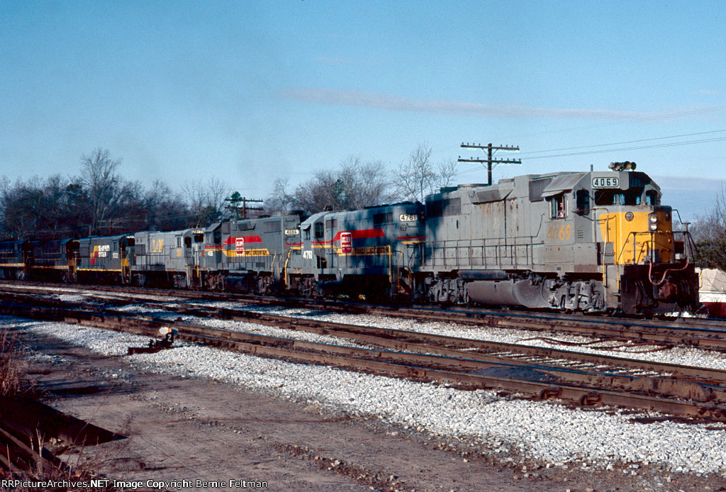 Seaboard System GP38-2 #4069, with an assortment of power, leads southbound train #323 down the ...